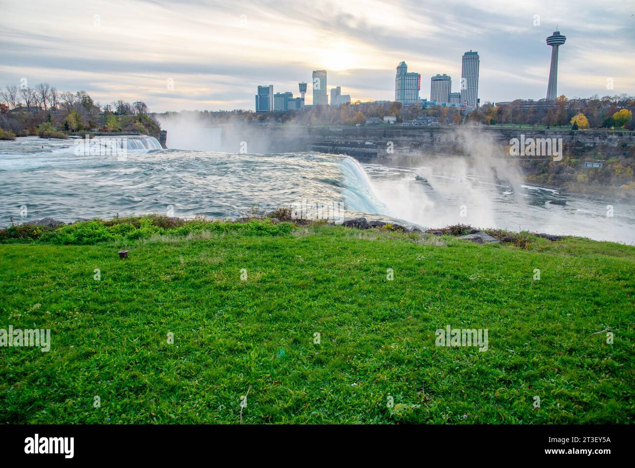 Grassy bank and fast flowing upstream of Niagara Falls from Goat Island ...