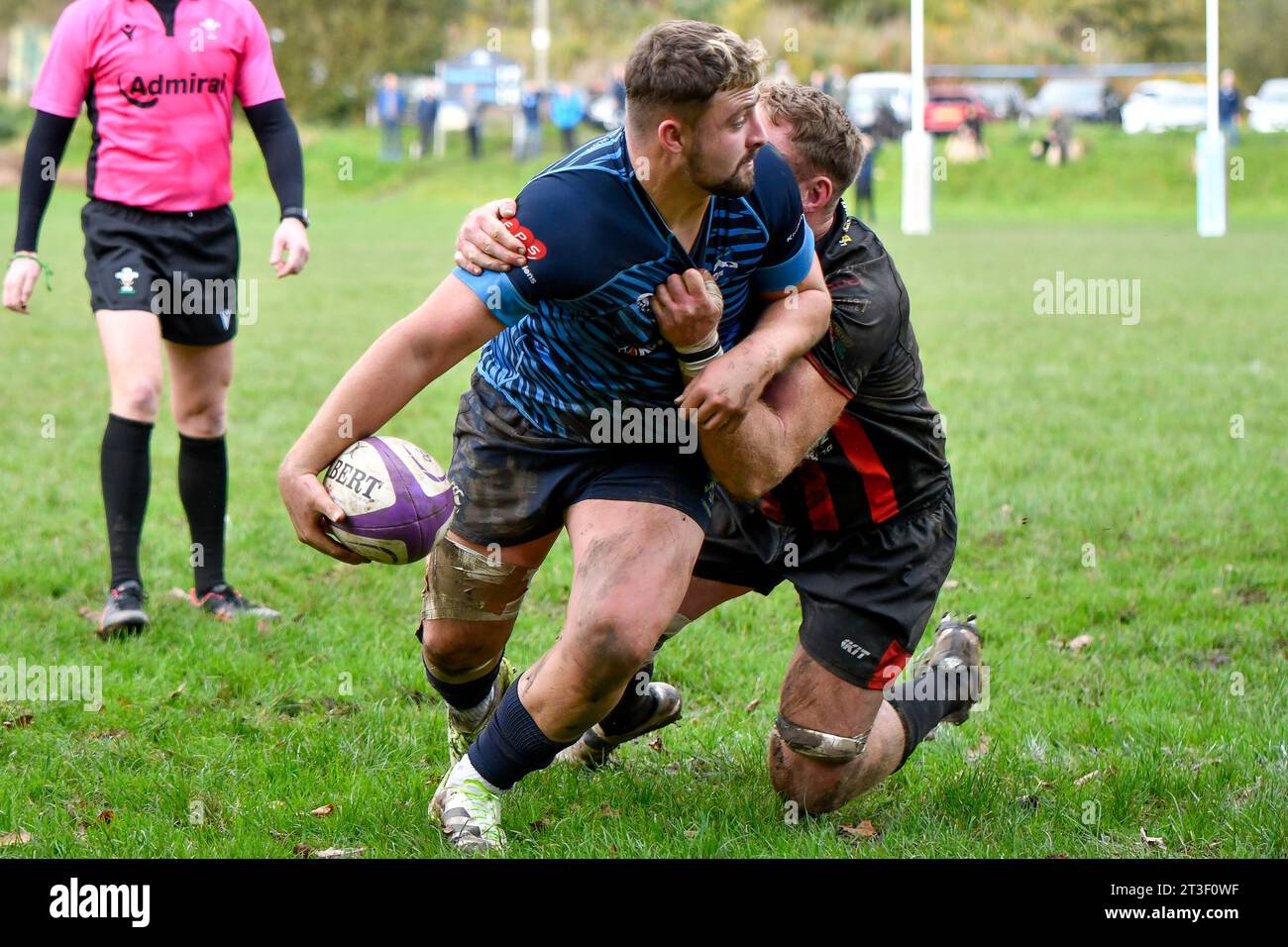 Trebanos, Wales. 21 October 2023. Rhys Harris of Trebanos is tackled by ...