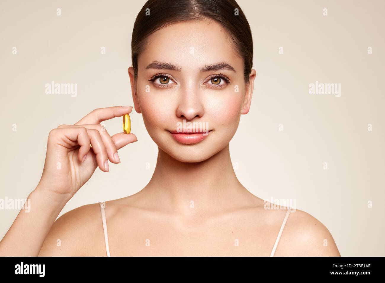 Vitamins. Close Up Of Happy Beautiful Girl With Pill With Cod Liver Oil ...