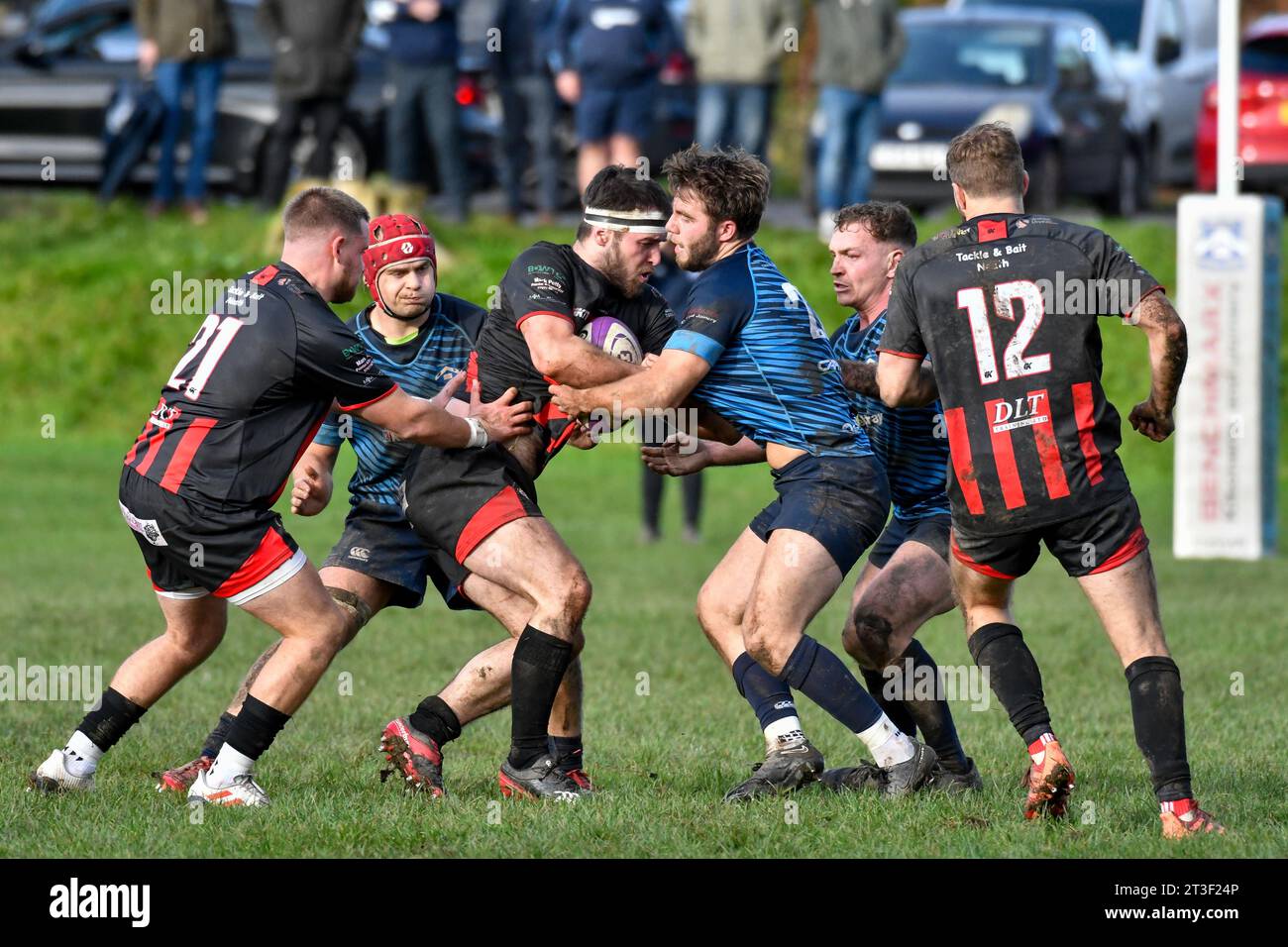 Trebanos, Wales. 21 October 2023. A Trebanos player gets to grips with ...