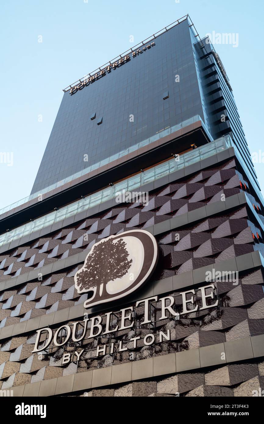 Double Tree Hilton Hotel. Logo on the facade of the hotel building ...