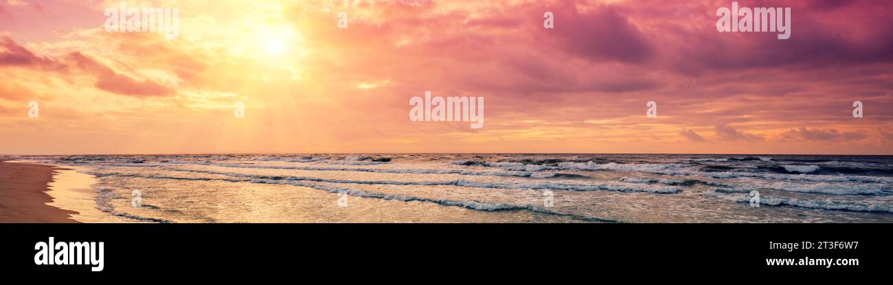 Purple sunrise over sea Stock Photo - Alamy