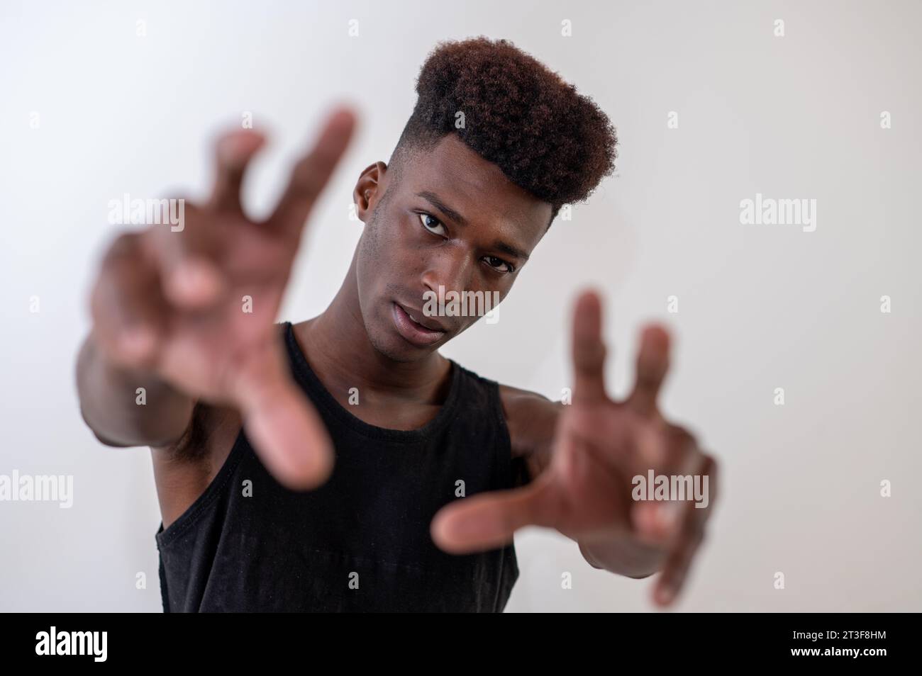 Handsome young man seen making hand gesture Stock Photo - Alamy