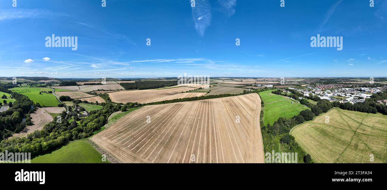 Panorama of the countryside with rolling fields and hedges around ...