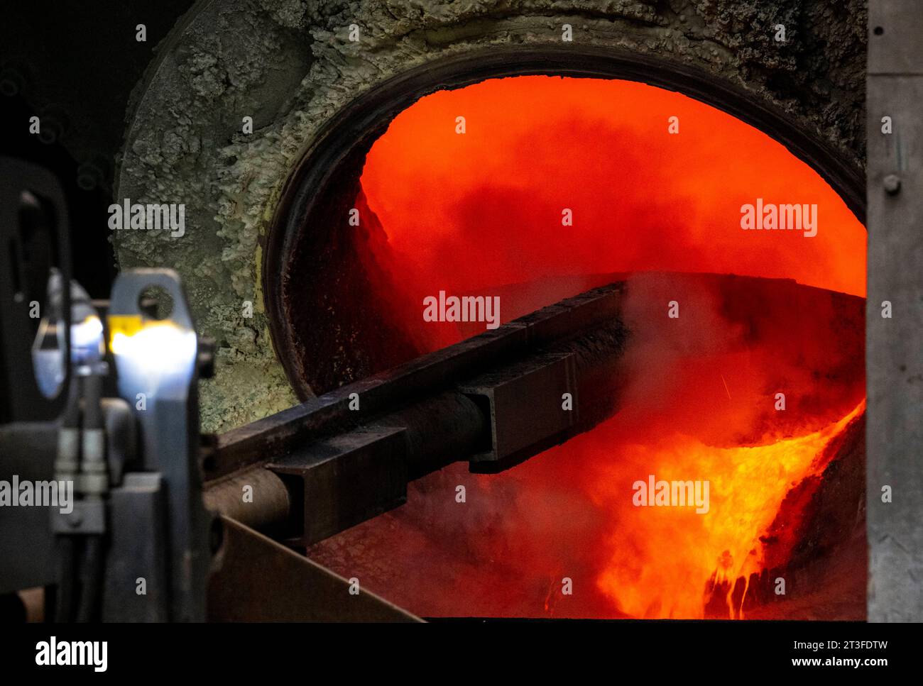 Freiberg, Germany. 25th Oct, 2023. Liquid lead is tapped in a furnace ...