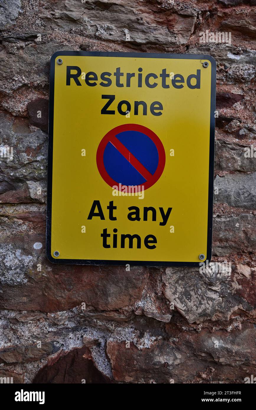 A No Parking sign in a Restricted Zone Stock Photo - Alamy