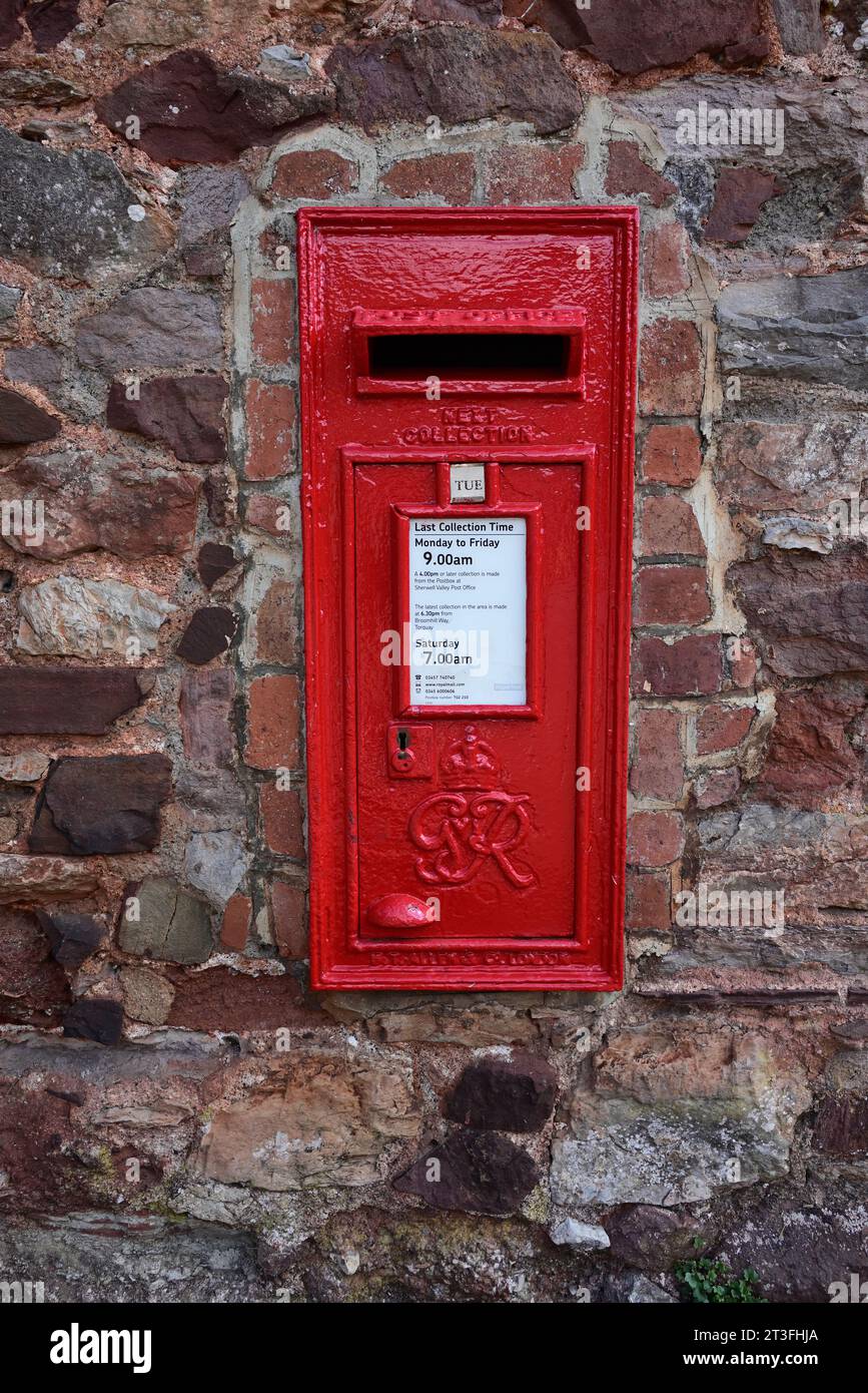 An English wall mounted post box bearing the initials GR for King ...