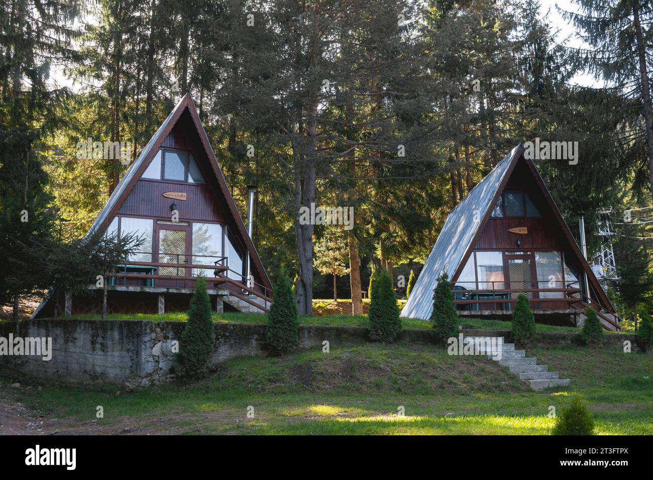 Two beautiful small villas in a forest holiday resort hotel Stock Photo ...