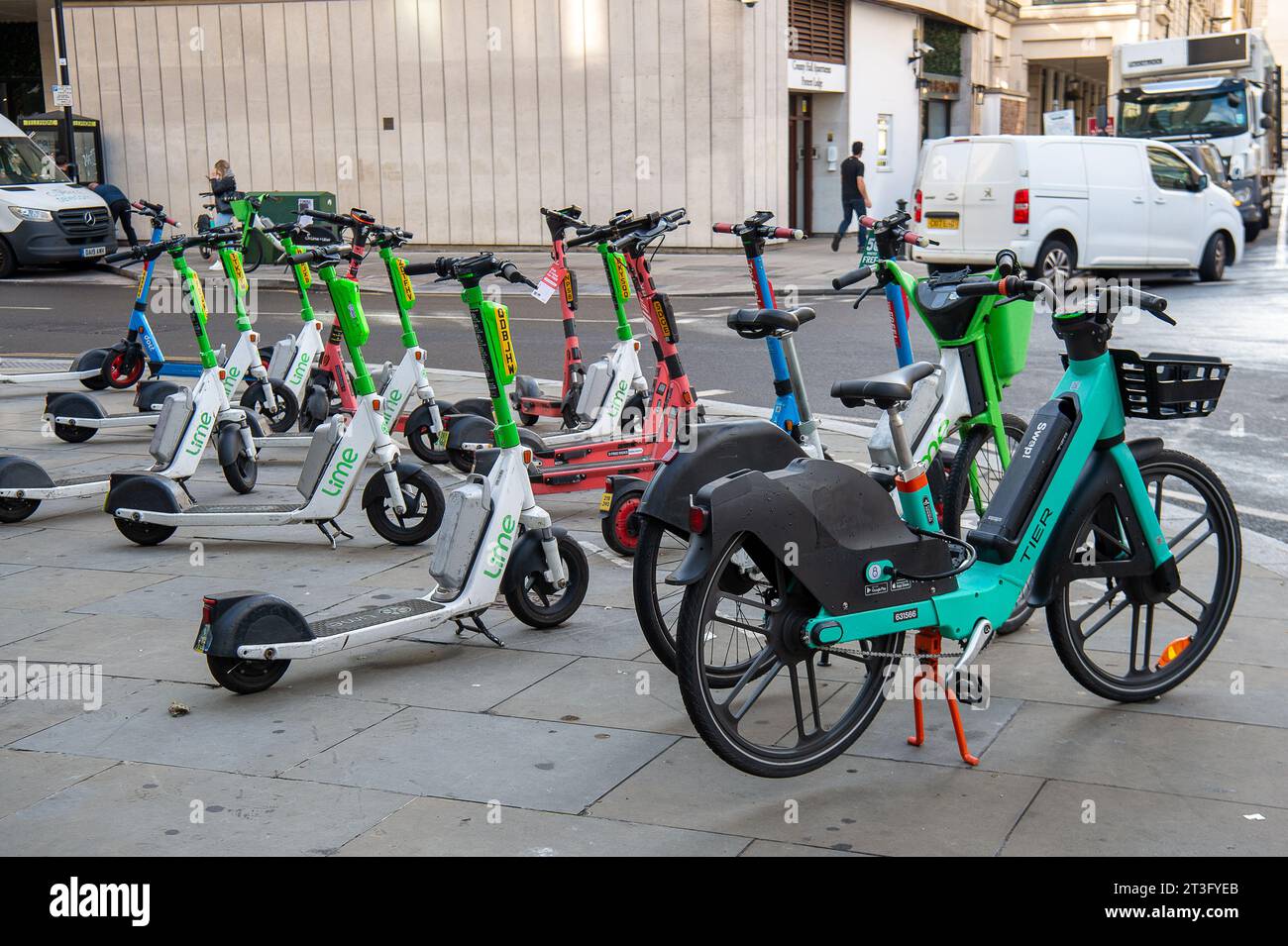 London, UK. 24th October, 2023. E-bikes and e-scooters for hire on a ...