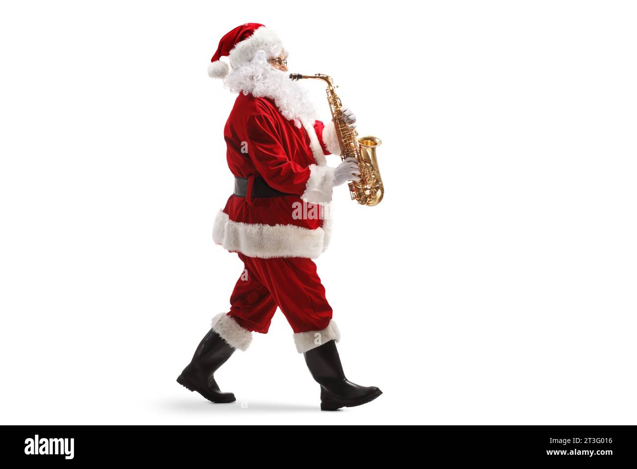 Full length profile shot of Santa claus walking and playing a sax ...