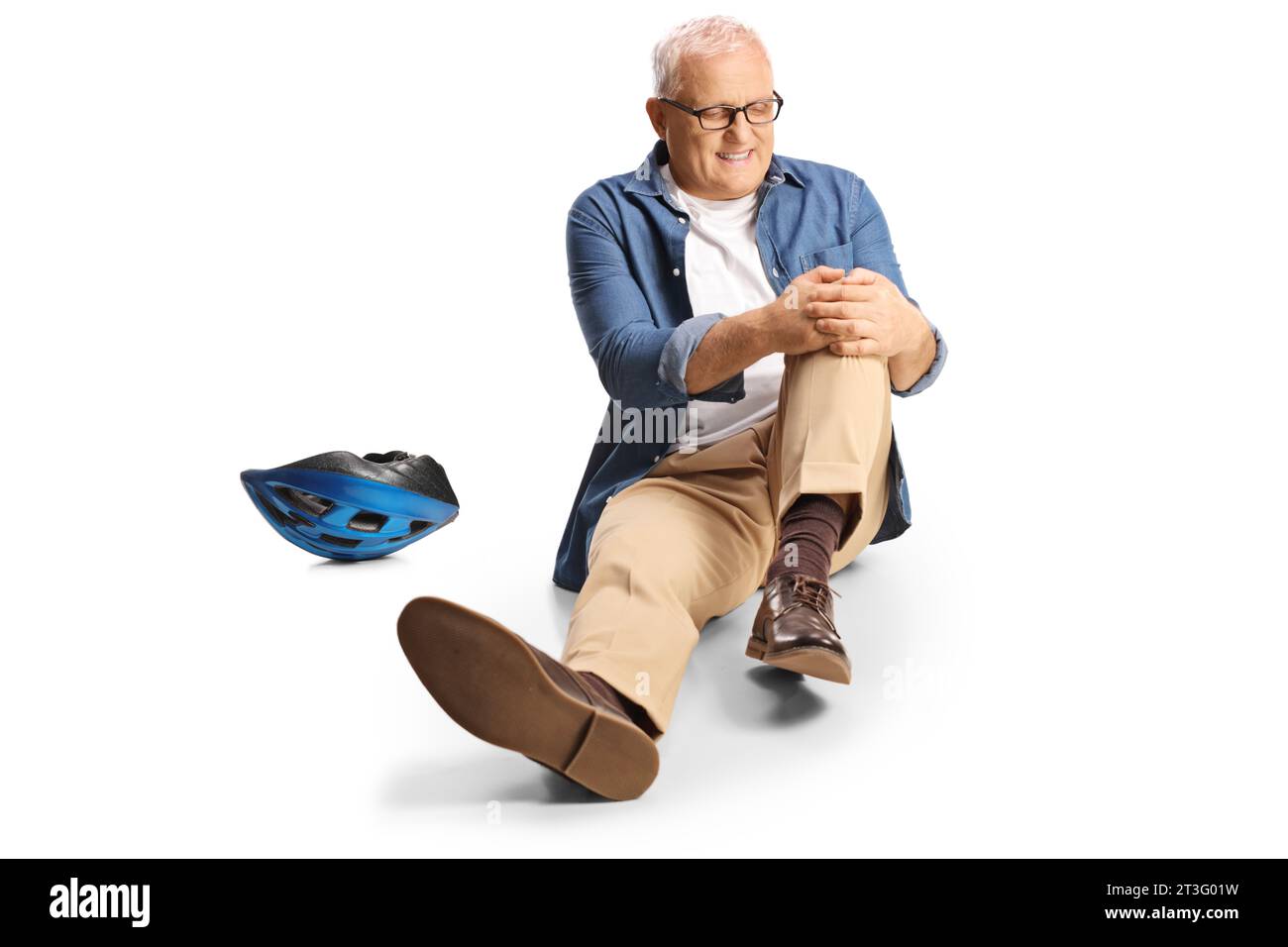 Man with an injured knee sitting on the ground isolated on white ...