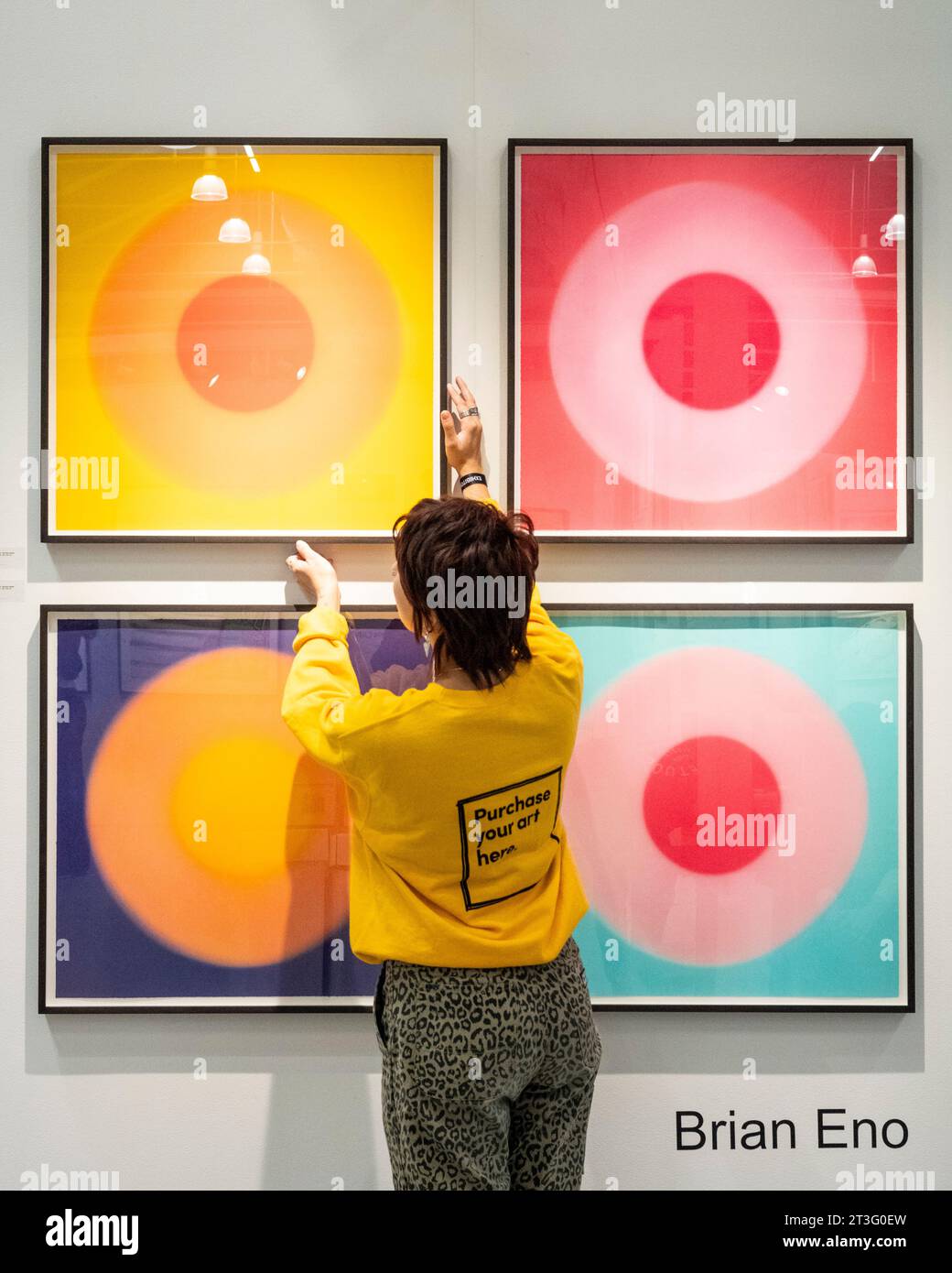 London, UK. 25 October 2023. A staff member with etchings by Brian Eno ...