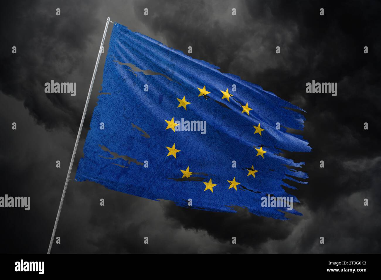 European Union torn flag on dark sky background Stock Photo - Alamy