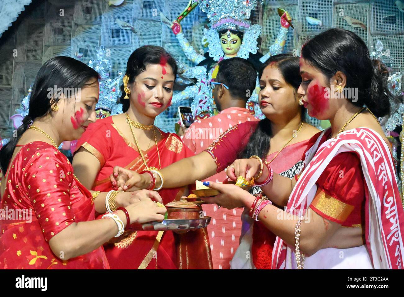 Women joyfully smear each other with Vermillion as part of the ...