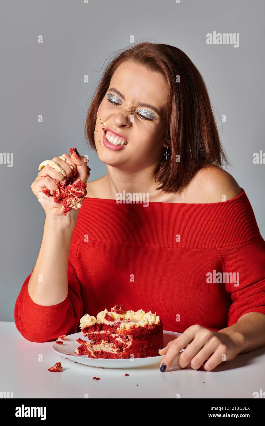 angry birthday girl in red attire smashing delicious piece of birthday ...