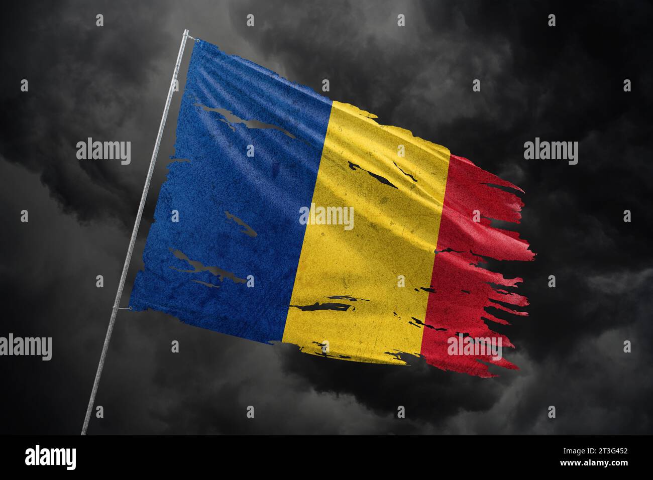 Romania torn flag on dark sky background Stock Photo - Alamy