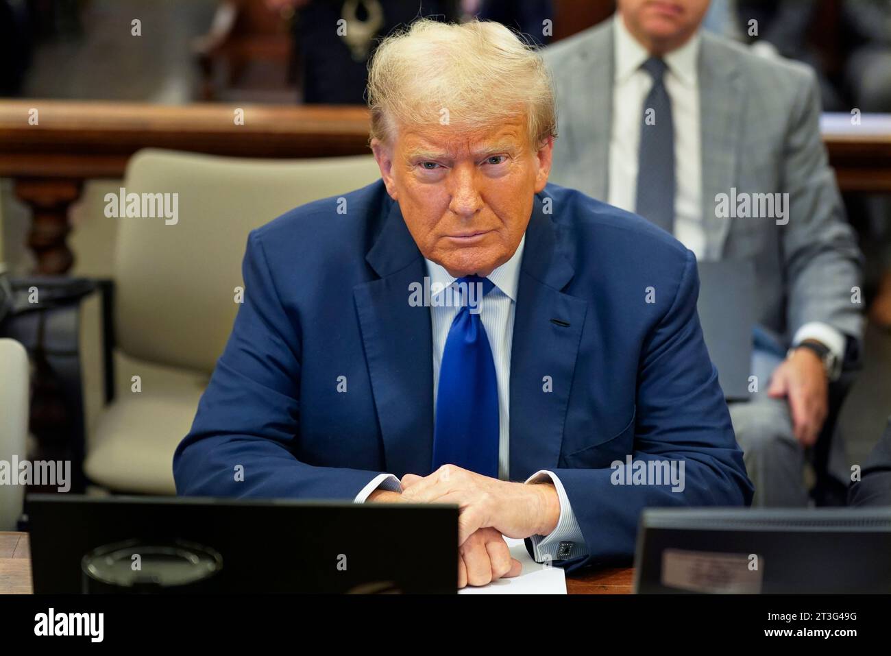 Former President Donald Trump, waits for the continuation of his civil ...