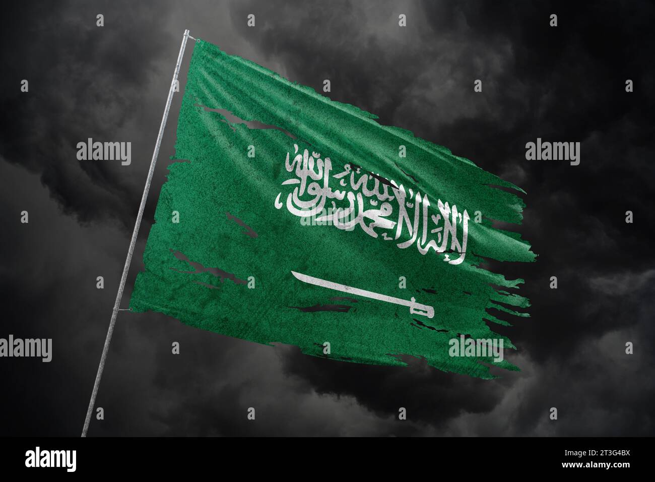 Saudi Arabia torn flag on dark sky background Stock Photo - Alamy