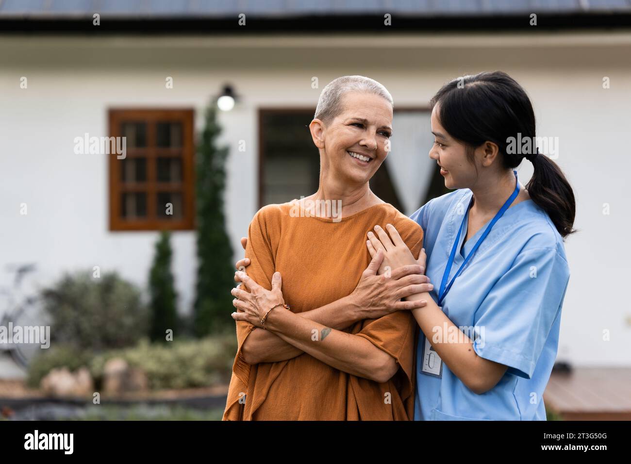 elderly touch hand on back of hand caregiver or nurses to express ...