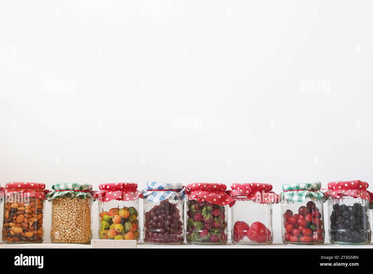 storing food vegetables, fruits and cereals in glass jars, white background, copy space Stock ...