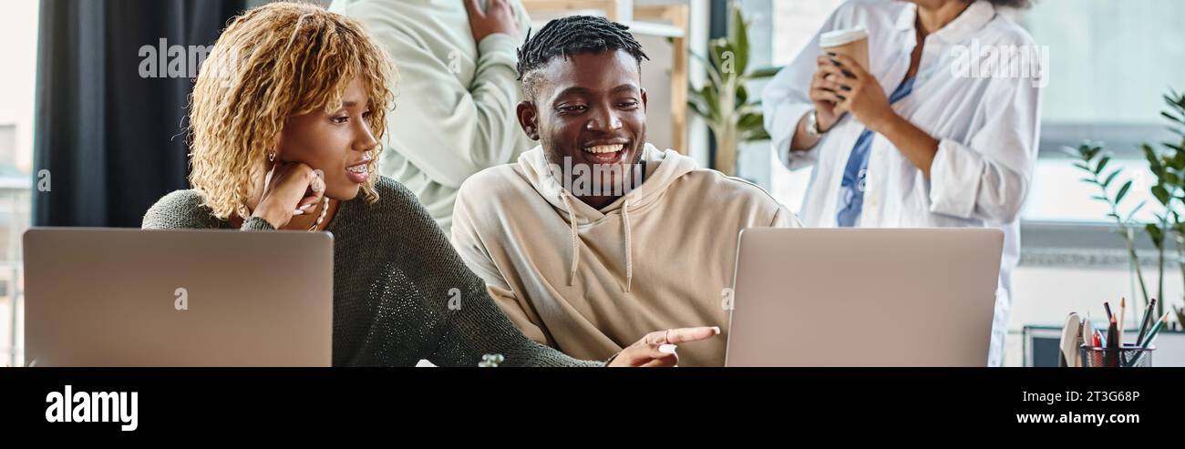 two young people with cropped view of their friends talking on backdrop ...