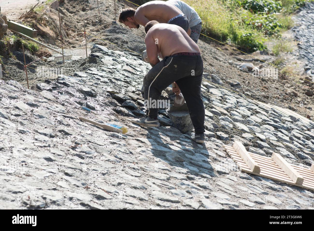 stone paving in road construction, public road network for mobility ...