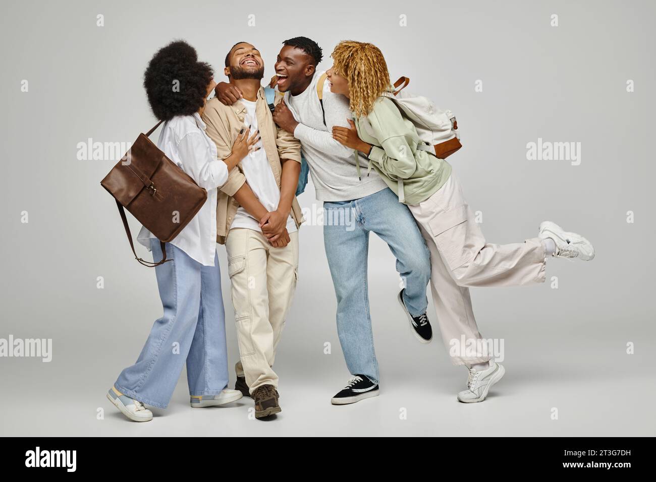 joyous african american friends hugging warmly and laughing sincerely ...