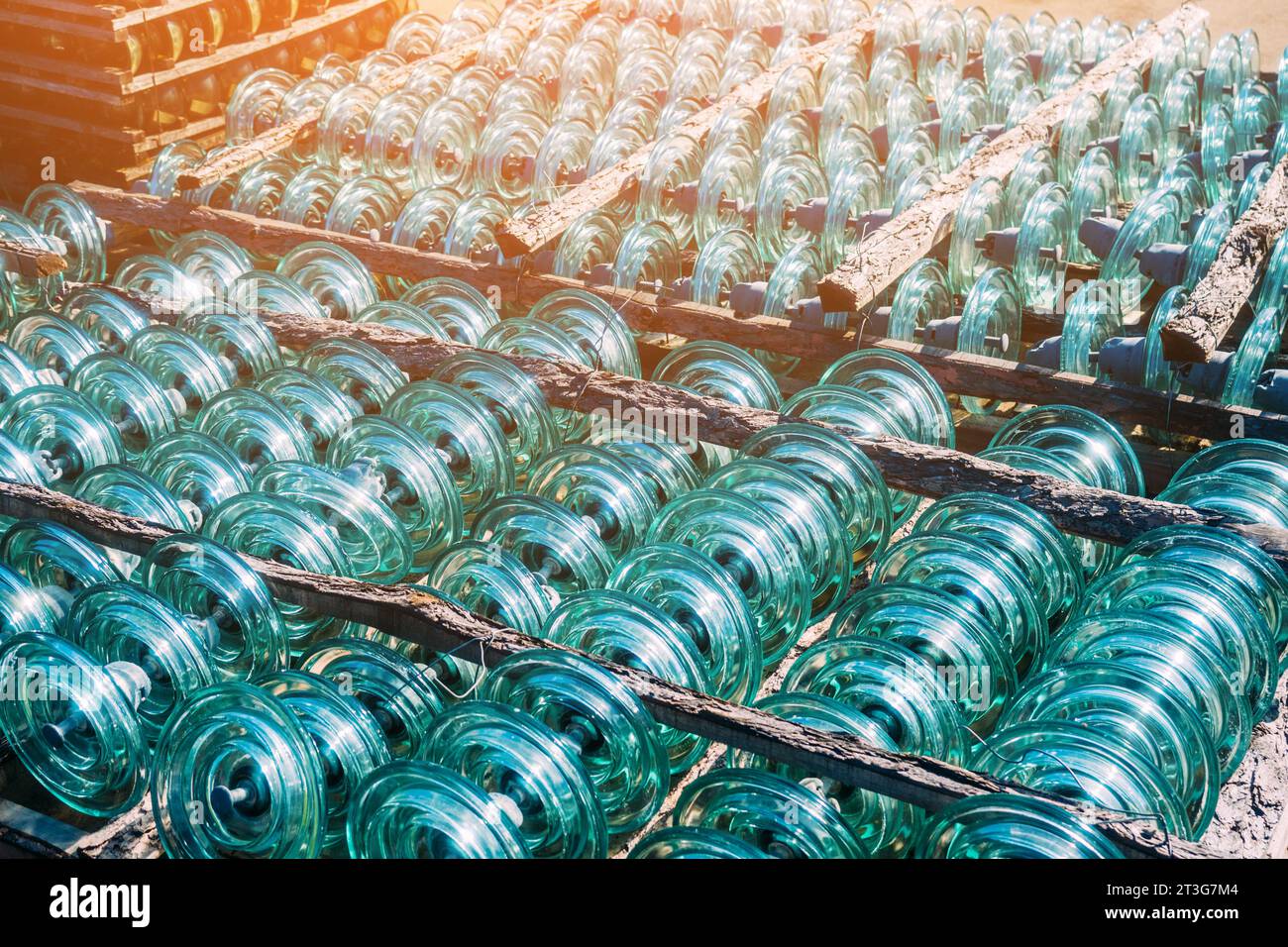 Glass transparent high-voltage insulator is in storage. Industrial ...