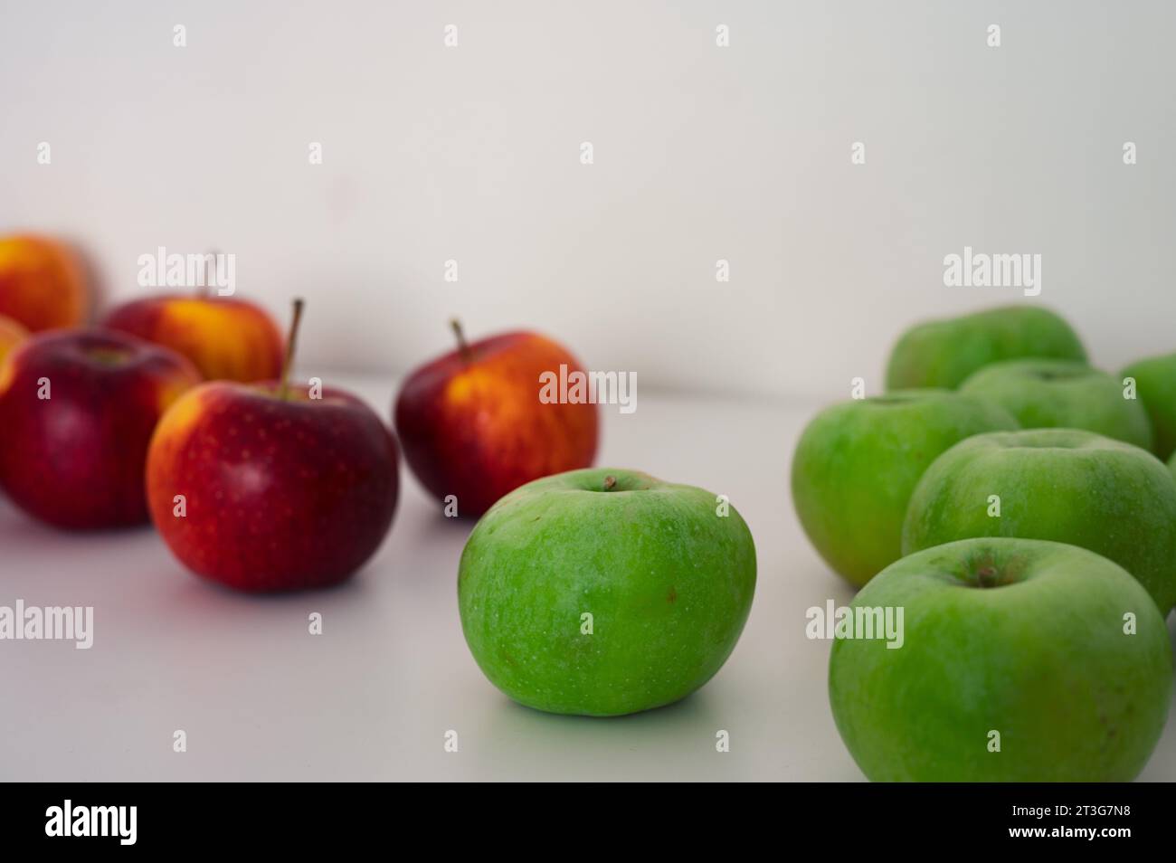 Two groups of green and red apples. Organic fresh fruits and image of ...