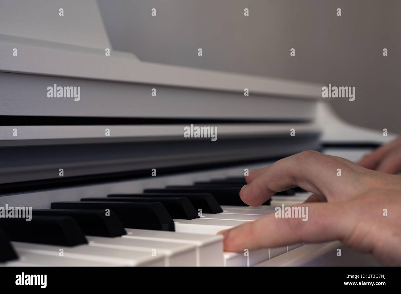 Mens hands playing on white upright piano. Musical theme. Piano ...