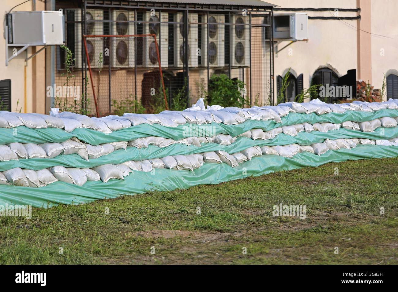 Wall of Sandbags and Tarp for Industrial Building Flood Protection ...