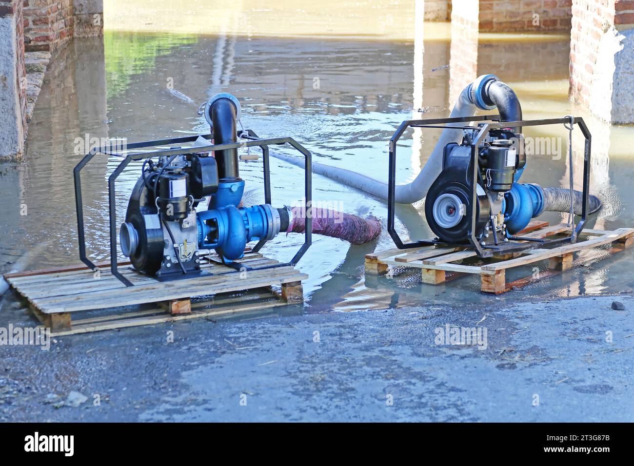 Two Petrol Engine Pumps at Cargo Pallets Pumping Out water From Flooded ...