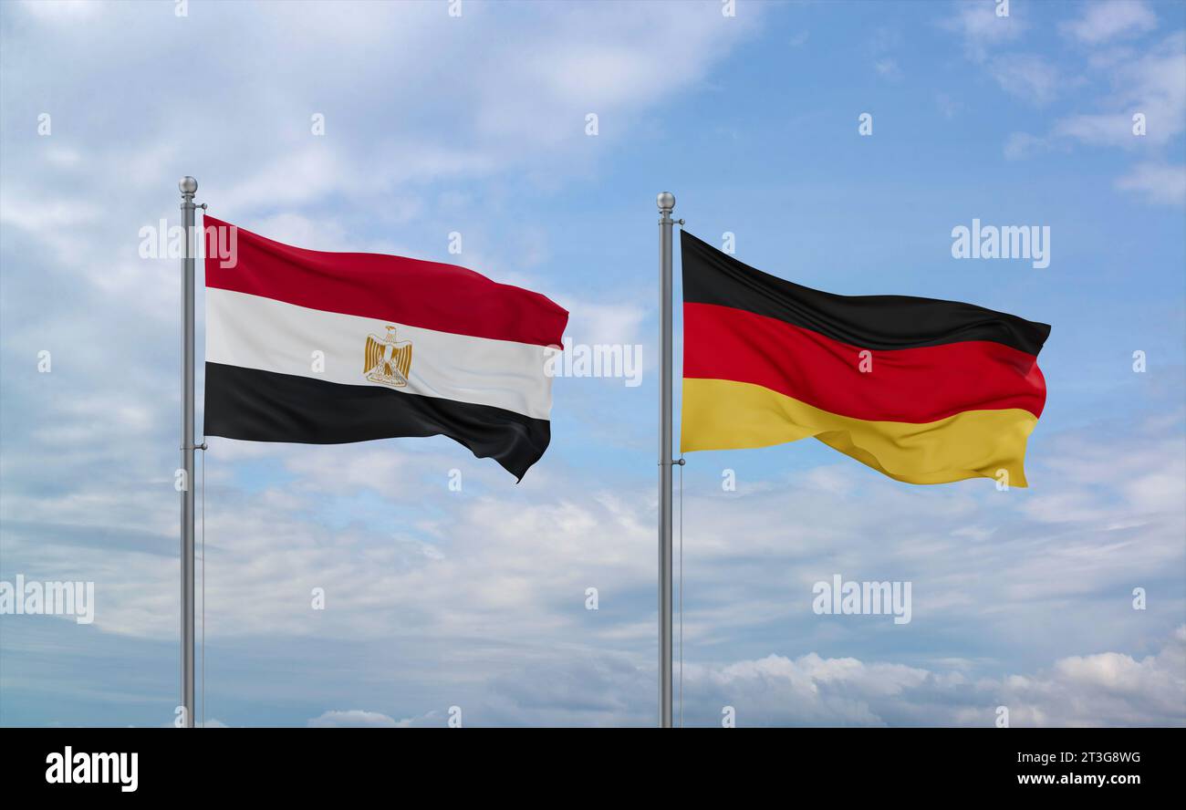 Germany and Egypt flags waving together on blue cloudy sky, two country ...