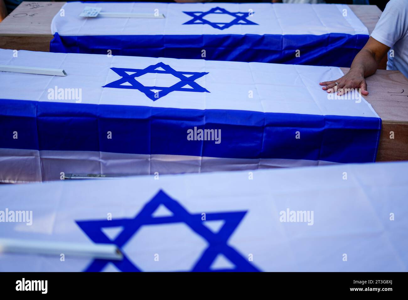 Mourners gather around the coffins of British-Israelis Lianne Sharabi ...