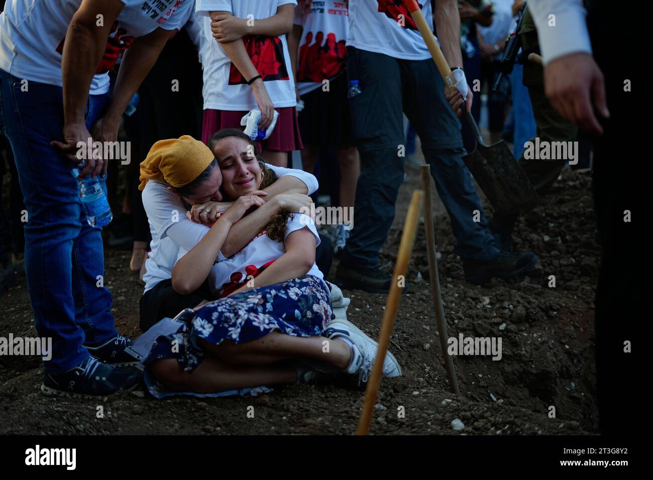 Mourners gather around the graves of British-Israelis Lianne Sharabi ...