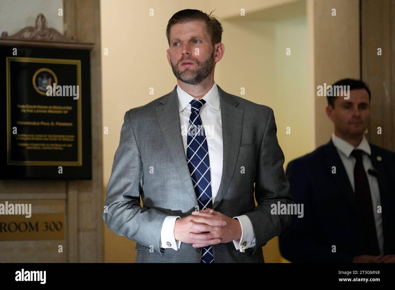 Eric Trump listens as his father, former President Donald Trump speaks ...