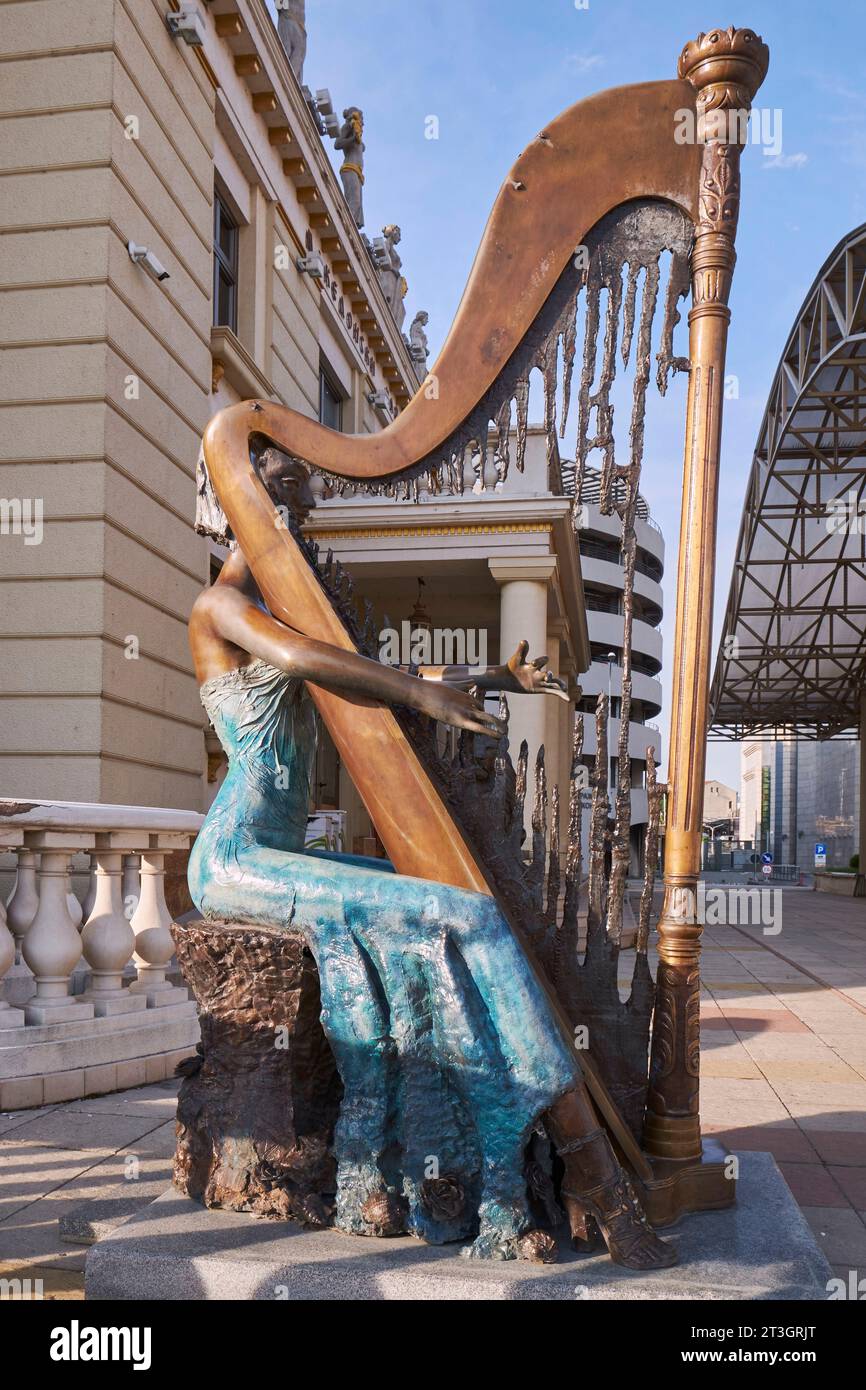 North Macedonia, Skopje, Statue of harpist on the forecourt of the ...