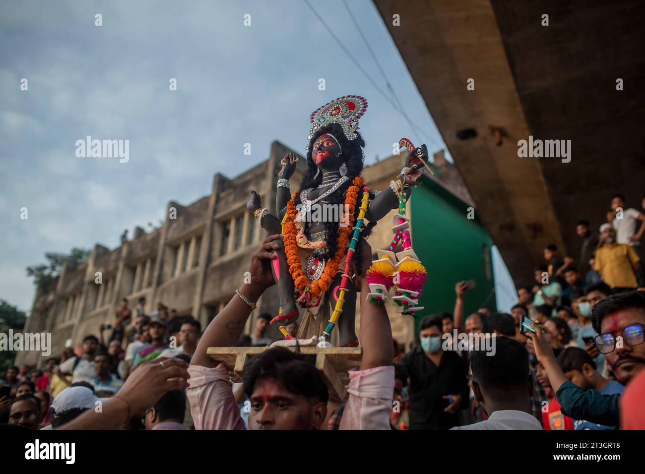 Dhaka, Bangladesh. 24th Oct, 2023. Hindu devotees immerse a clay idol ...