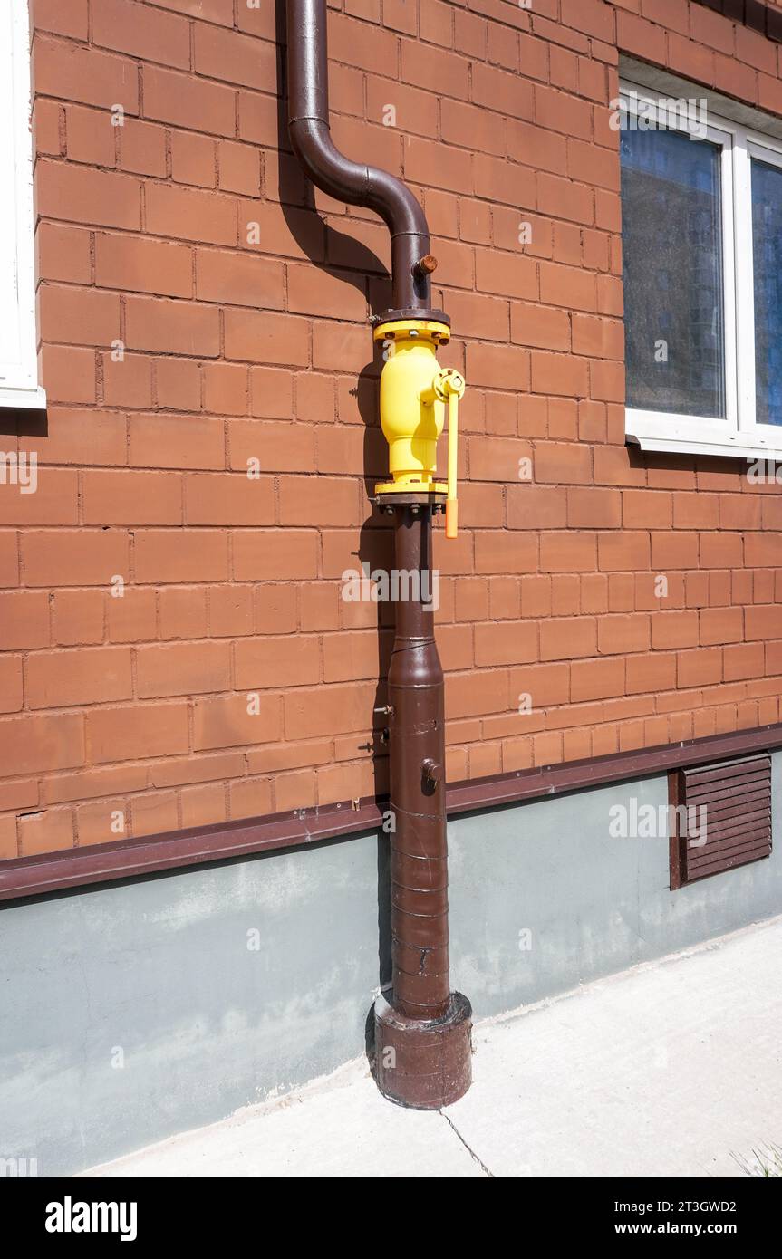 Gas entry point to a residential building. Gas pipe with valve on the ...