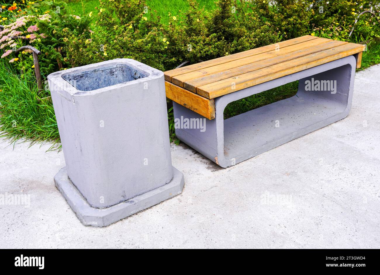 Bench for rest and garbage bin for waste at the city street Stock Photo ...