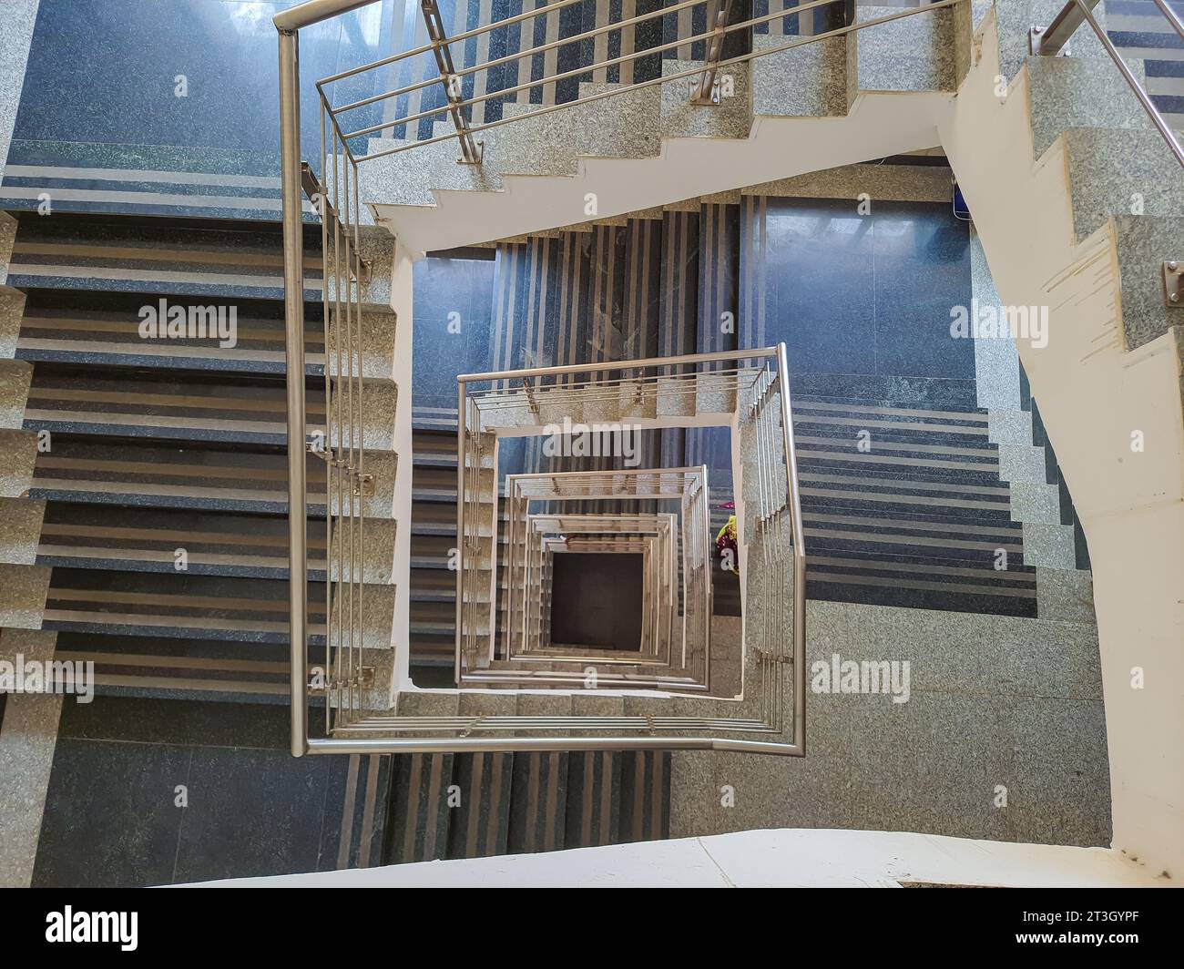 high rise building staircase symmetry shot from top angle at day image ...