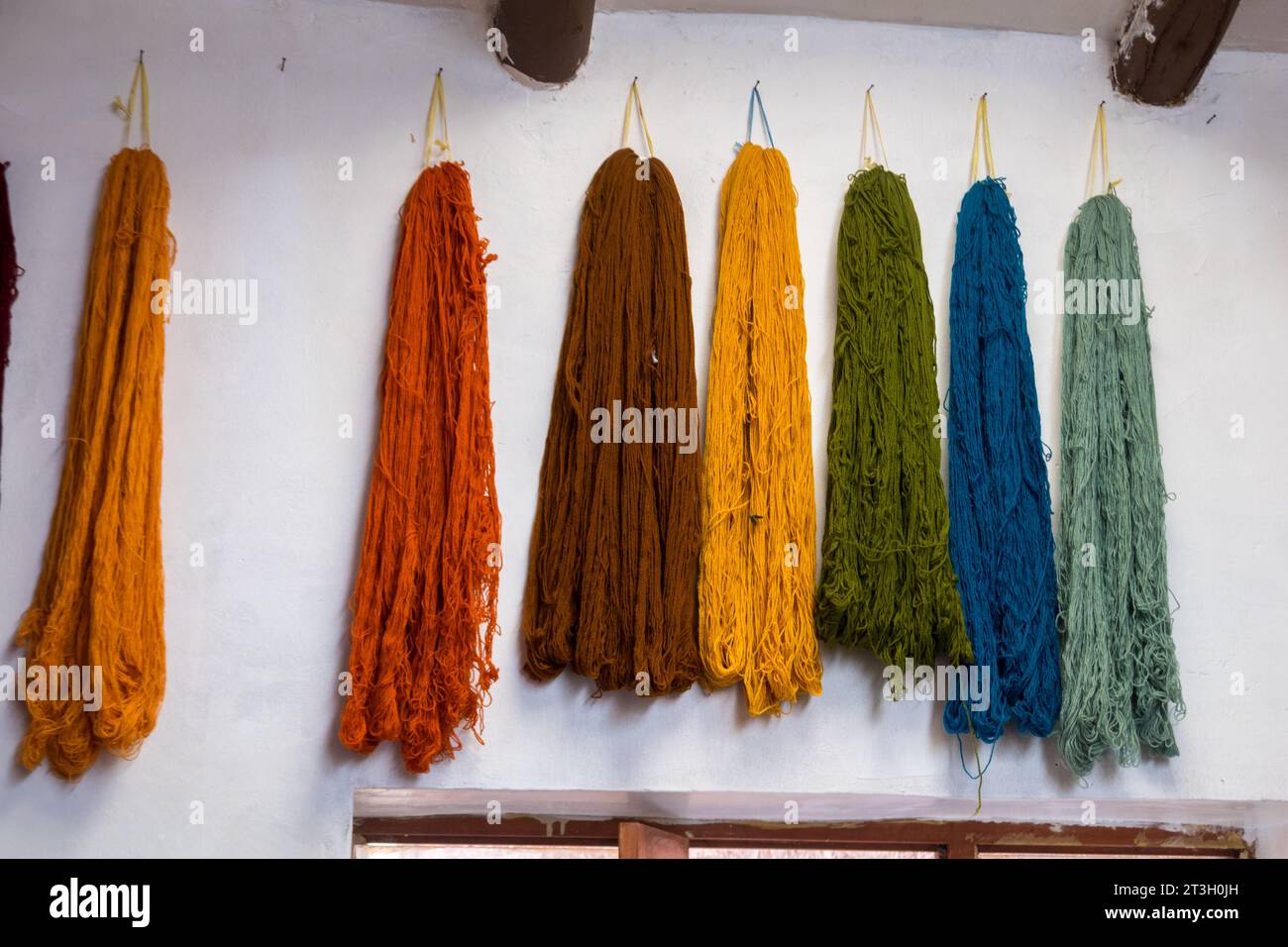 Wall of wool bundles naturally colored, near Maras, Peru Stock Photo ...