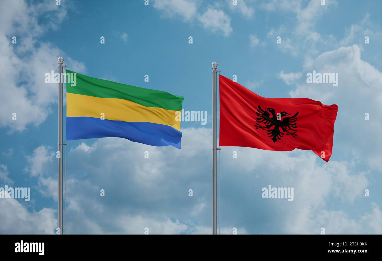 Gabon and Albania flags waving together in the wind on blue cloudy sky Stock Photo - Alamy