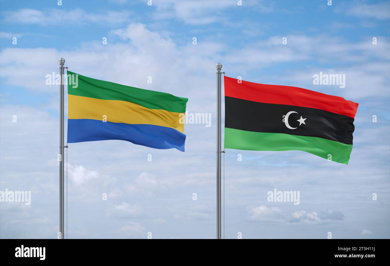 Libya and Gabon flags waving together in the wind on blue cloudy sky ...
