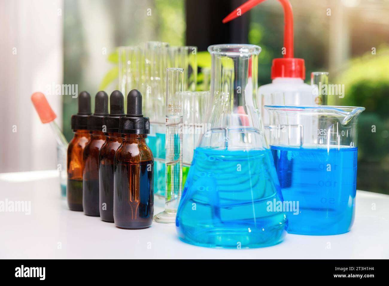 Blue experiment water in beaker and flask in chemistry science ...