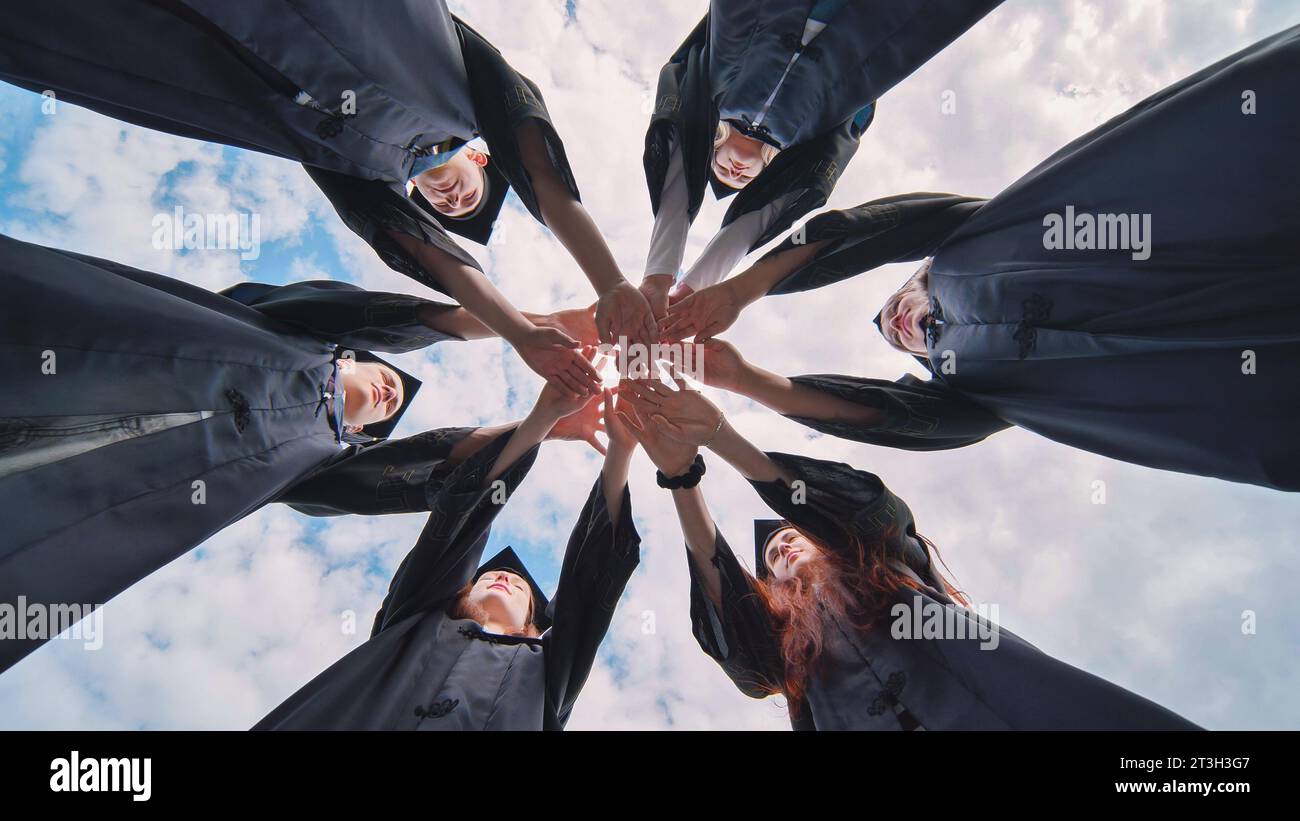Team of college or university students celebrating graduation. Group of ...