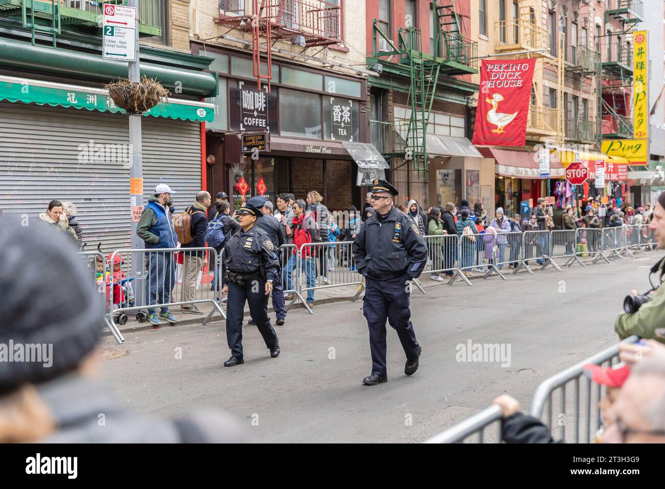 New York, Chinatown, USA - February 12, 2023: Policemen watching in Chinatown ahead of the New ...