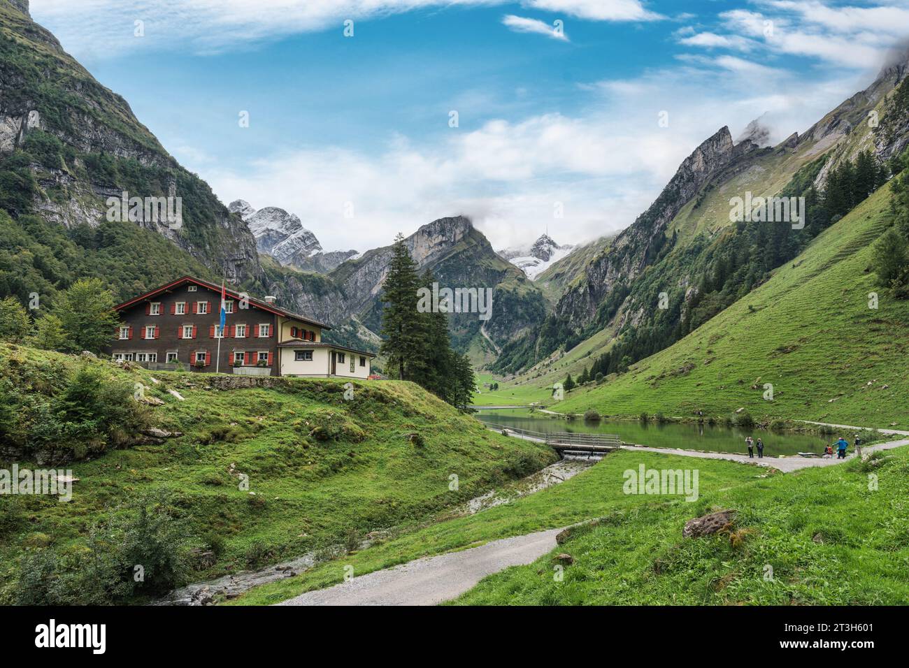 Viewpoint of Seealpsee mountain lake with hotel and restaurant on hill ...