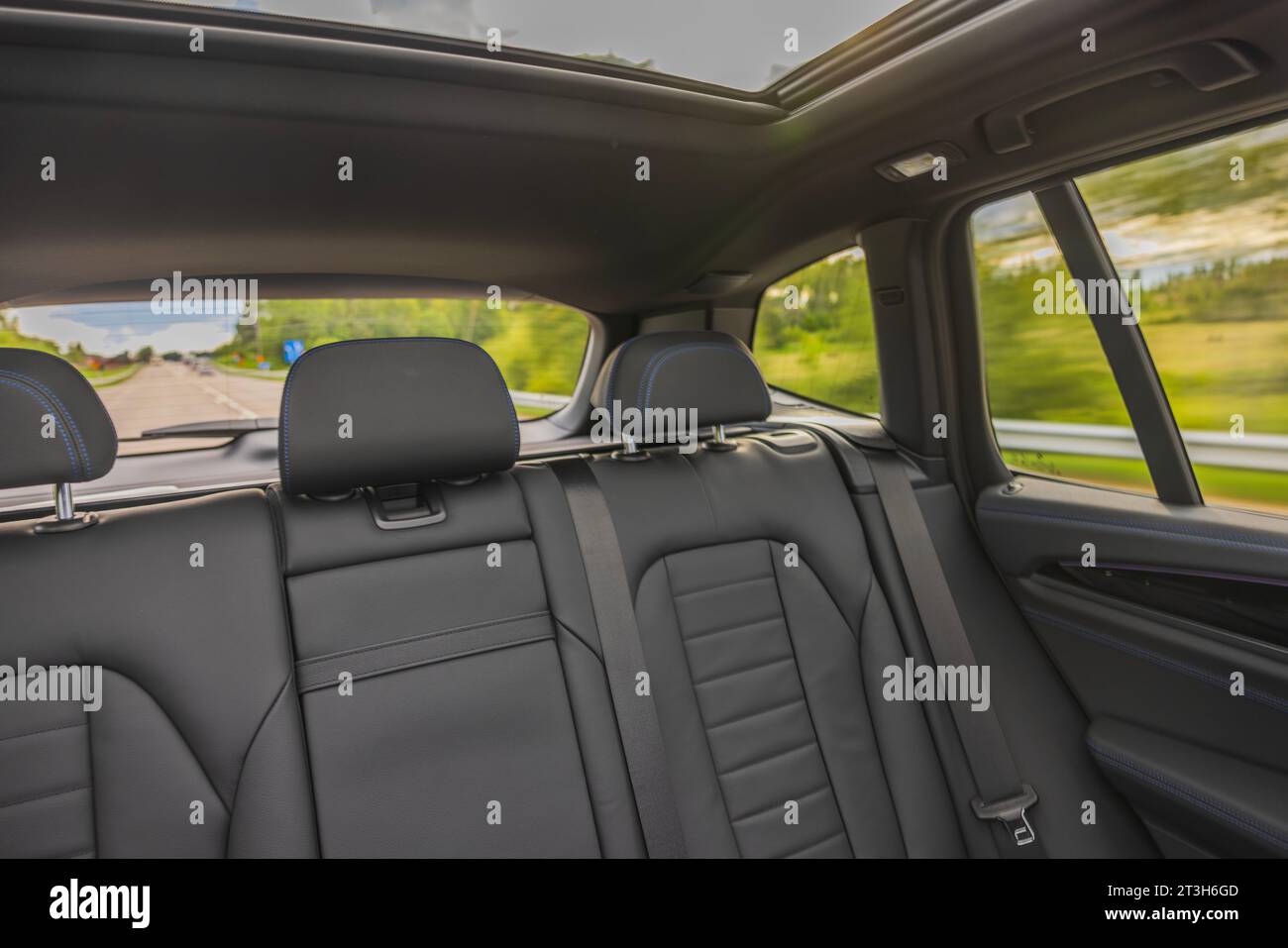 Beautiful rear view interior with leather seats and panoramic sunroof ...