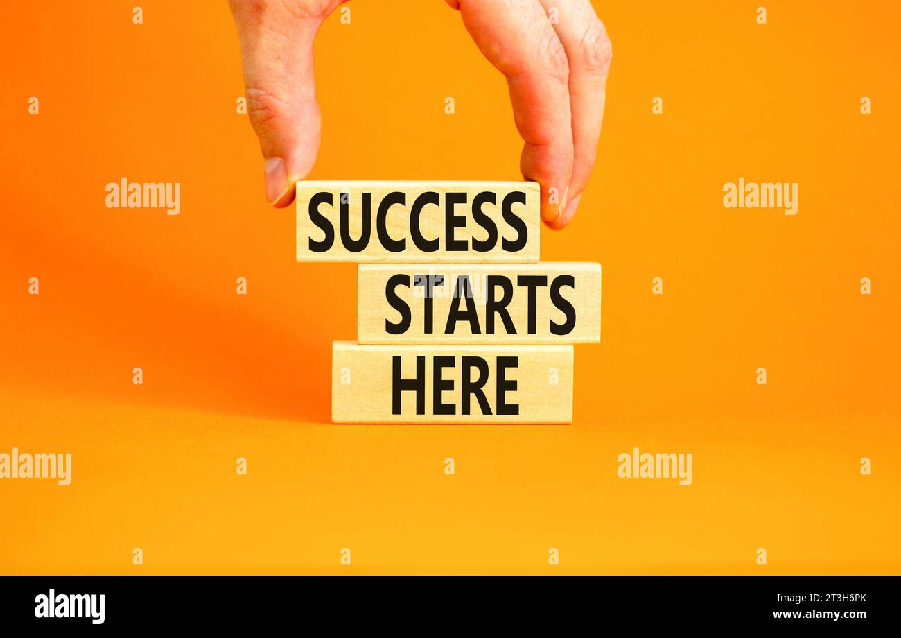 Success starts here symbol. Concept word Success starts here on beautiful wooden block ...